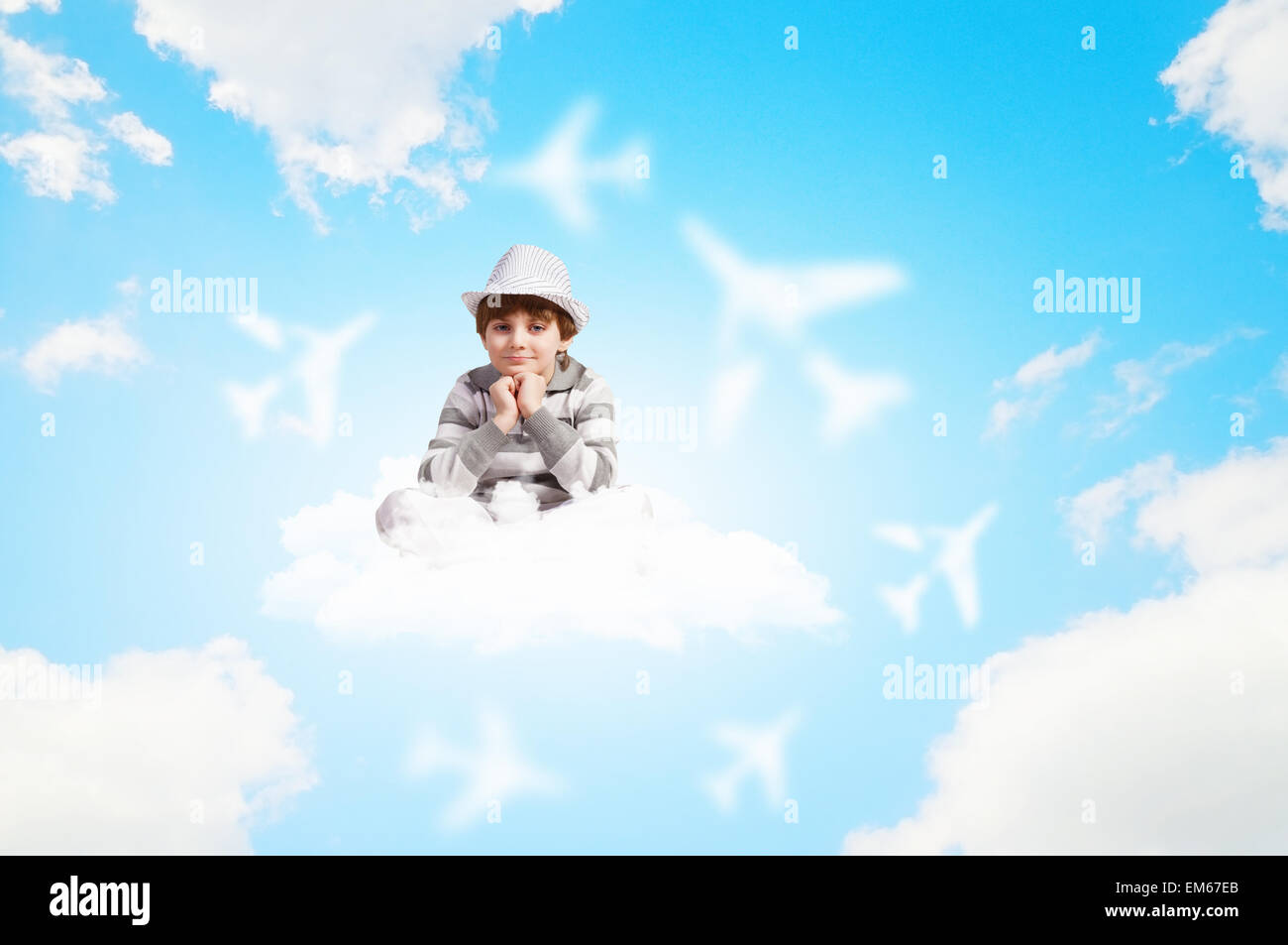 Boy sitting on cloud Stock Photo - Alamy