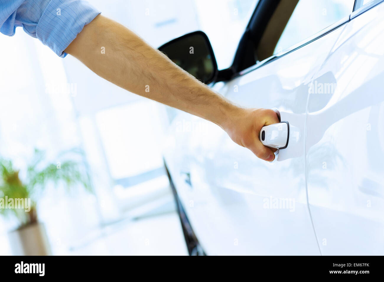 Man opening car Stock Photo - Alamy