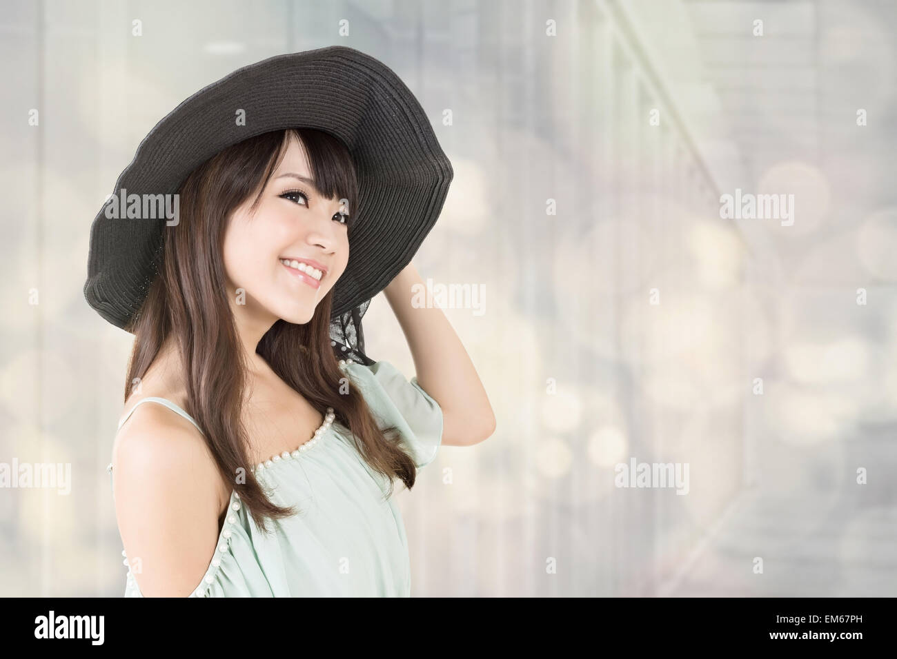 Elegant asian woman with hat Stock Photo - Alamy
