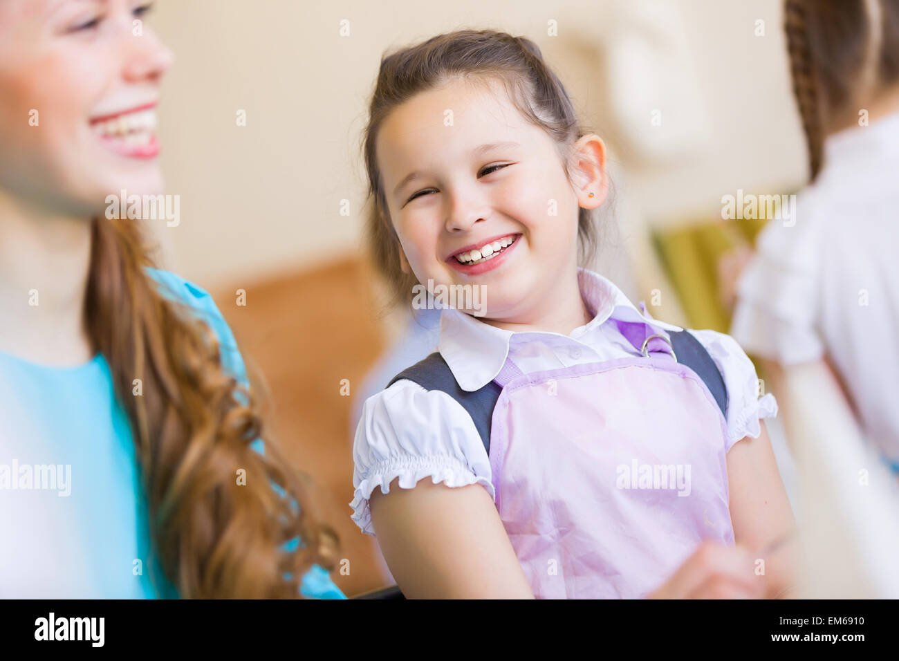 Cute girl and teacher Stock Photo - Alamy