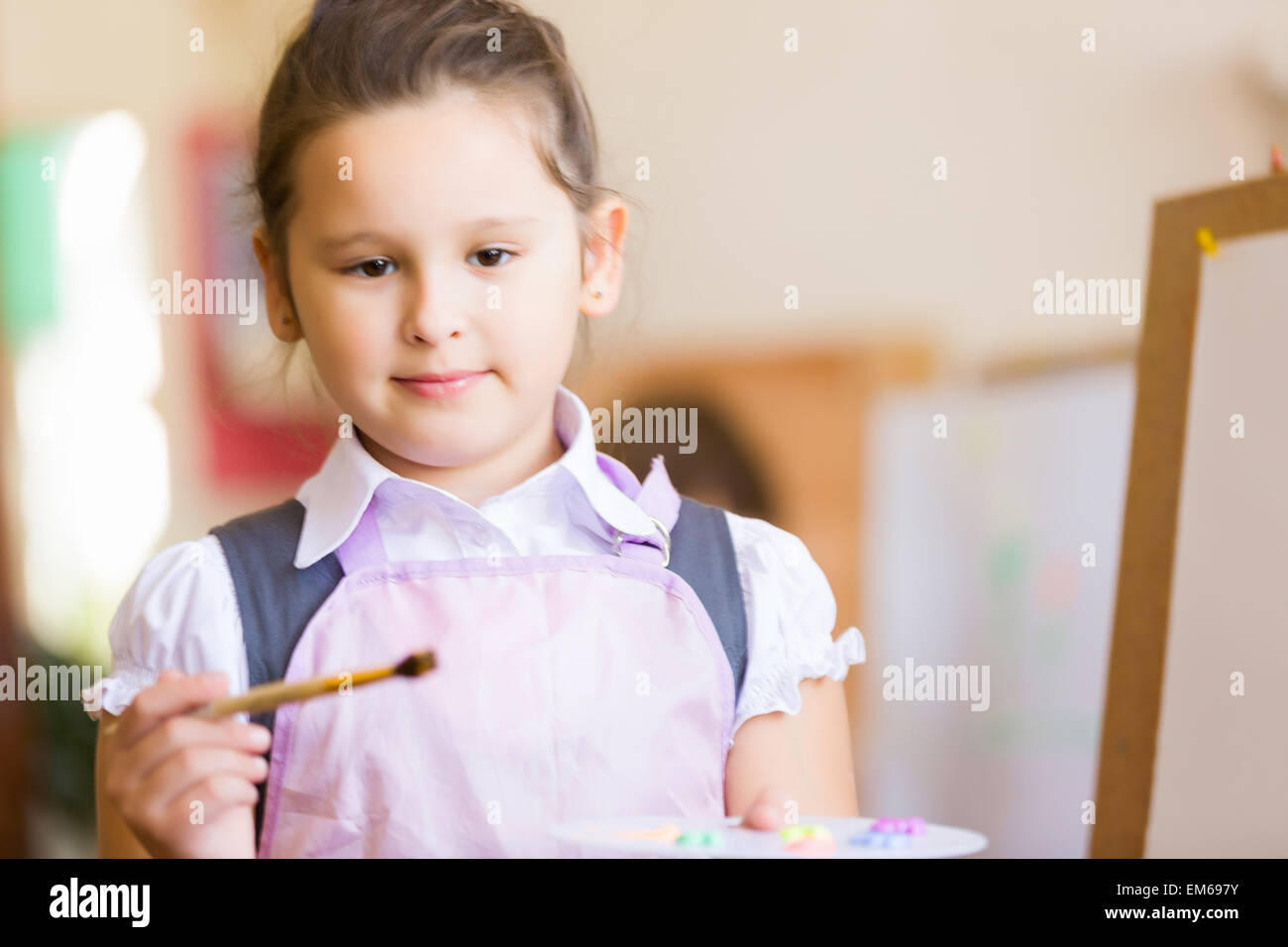 Cute girl painting Stock Photo - Alamy