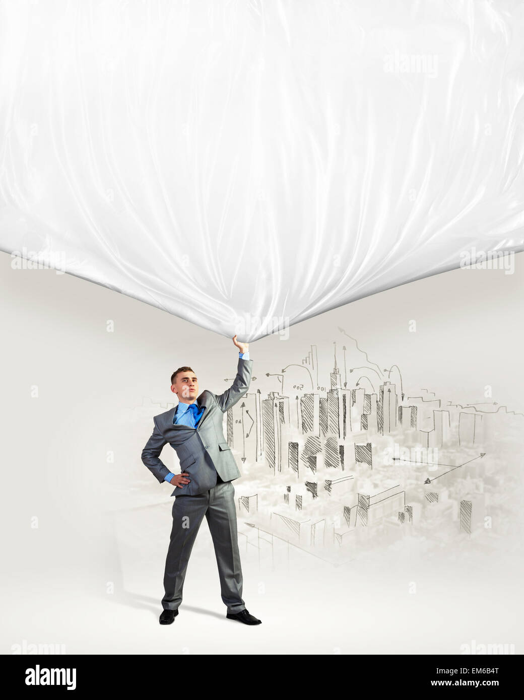 Young man pulling banner Stock Photo - Alamy