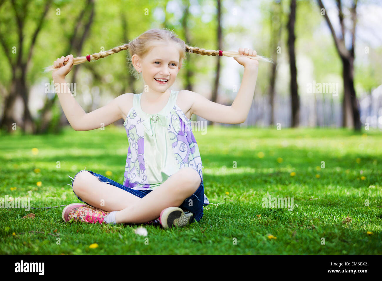 Little girl in park Stock Photo - Alamy