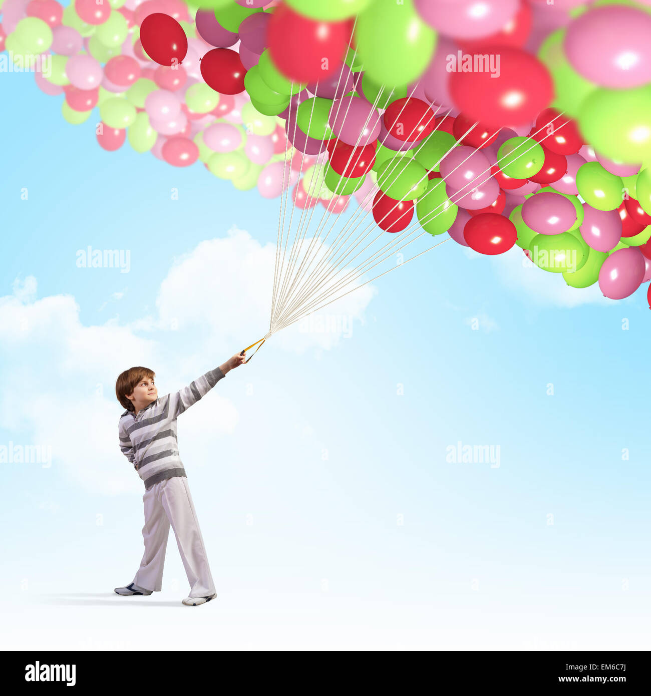 Cute boy with balloons Stock Photo - Alamy