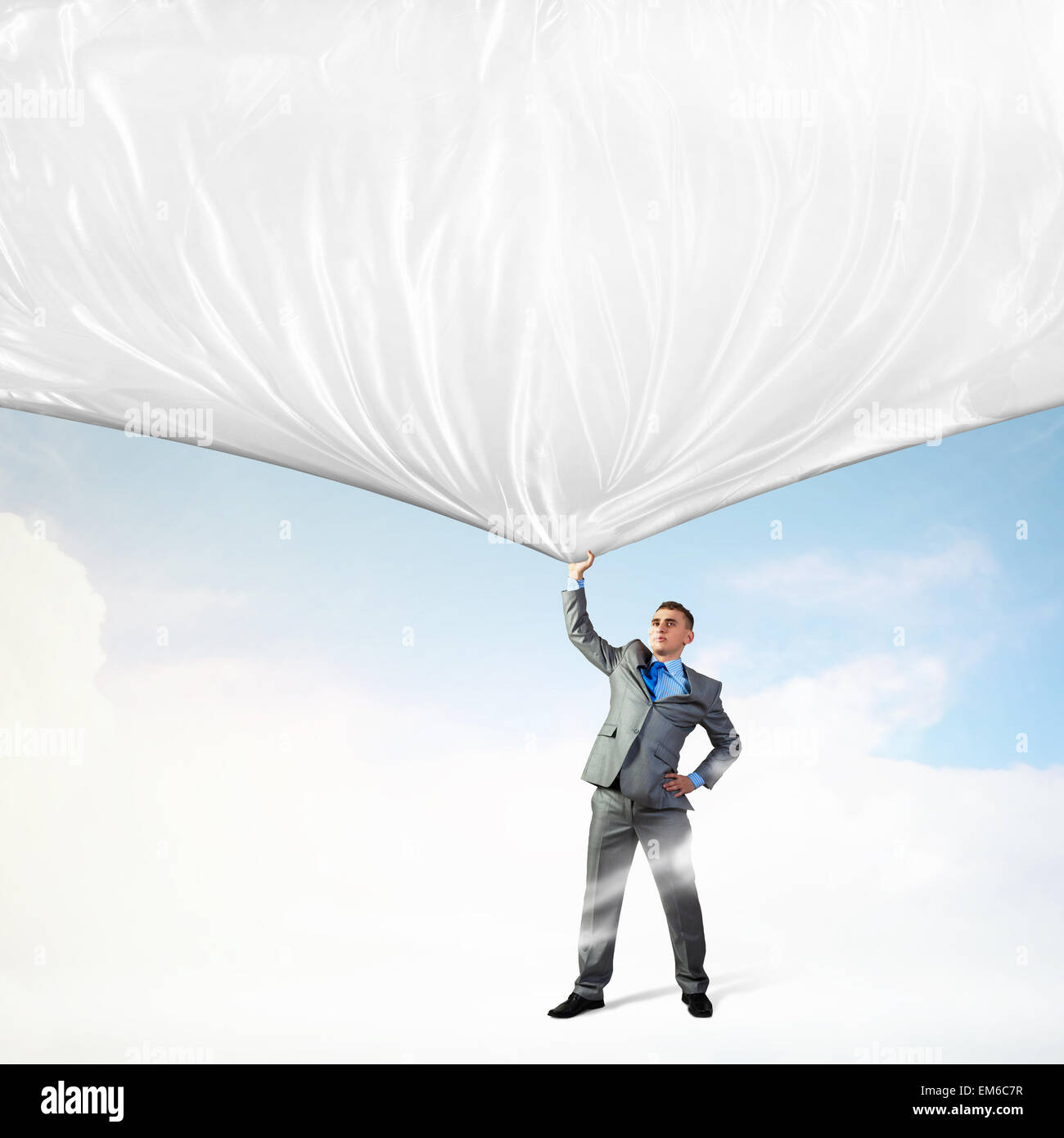 Young man pulling banner Stock Photo - Alamy