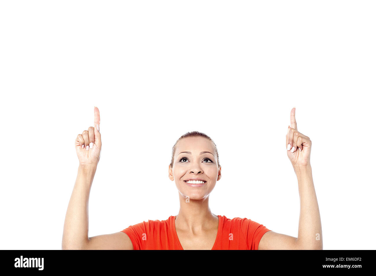 Pretty female model pointing upwards Stock Photo - Alamy