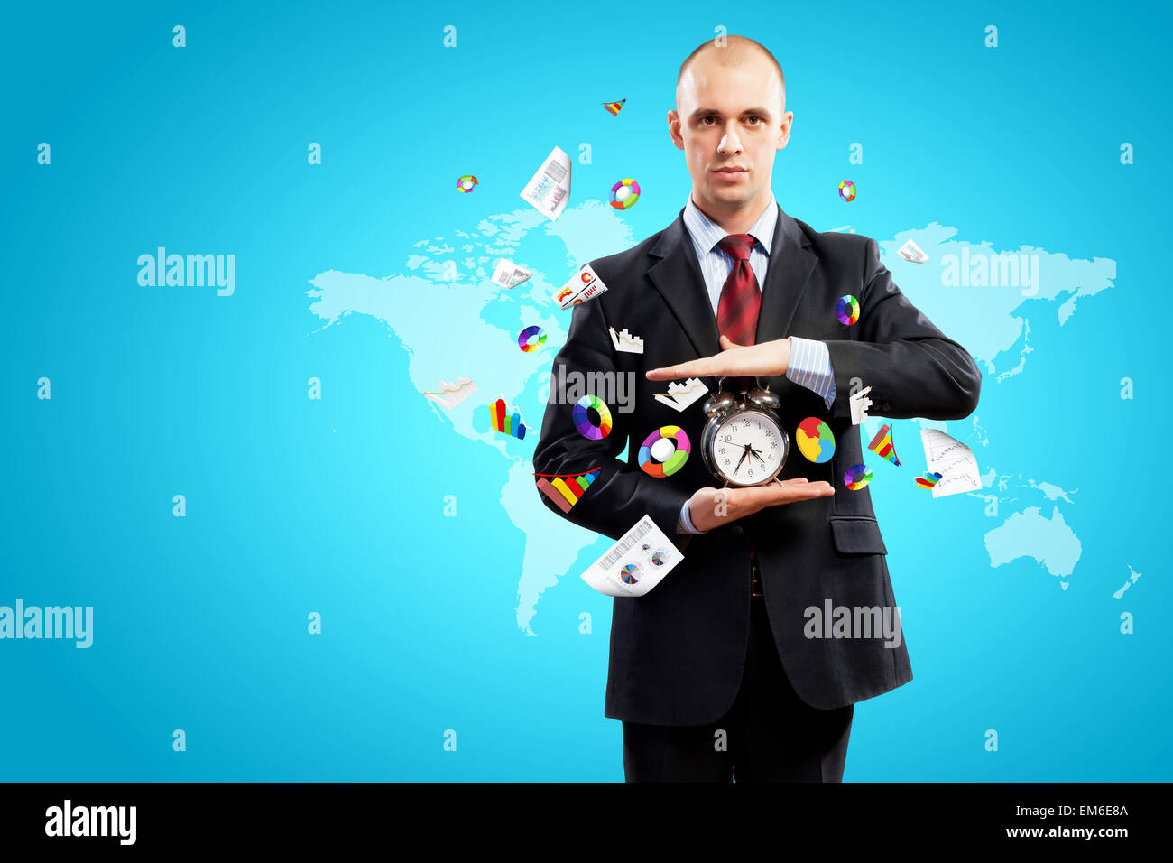 Business man holding alarmclock Stock Photo - Alamy