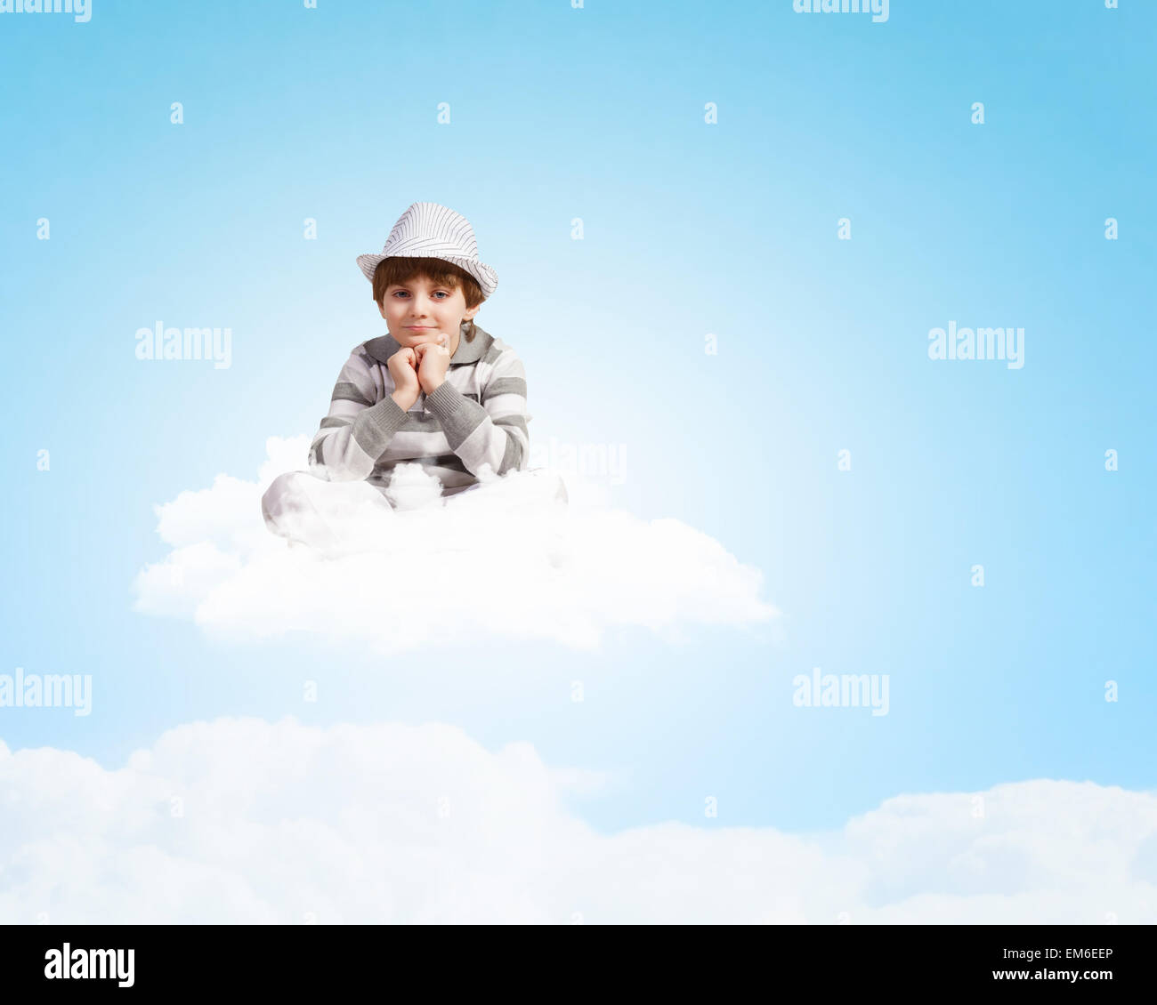 Boy sitting on cloud Stock Photo - Alamy