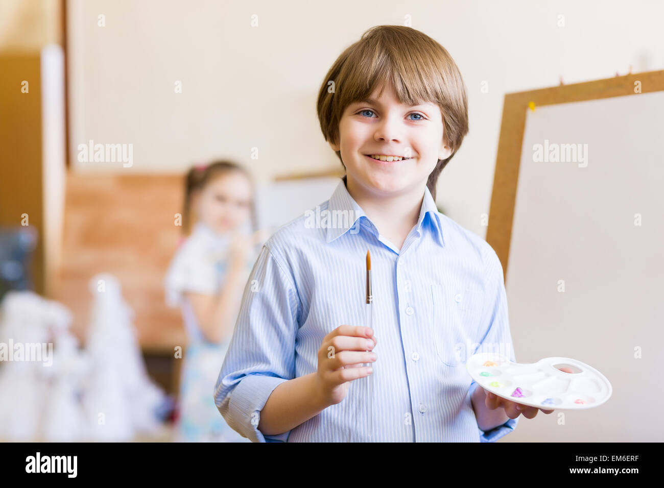 Cute boy painting Stock Photo - Alamy