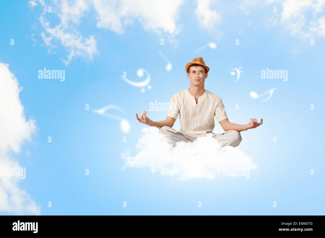 Young handsome man meditating sitting on clouds hi-res stock ...