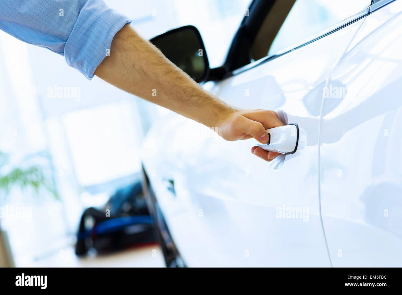 Man opening car Stock Photo - Alamy