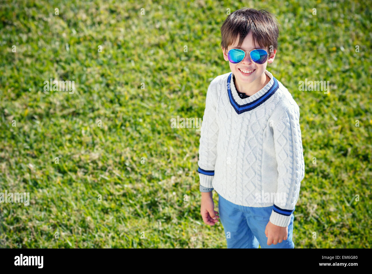 Cheerful little boy having relax outdoors Stock Photo - Alamy