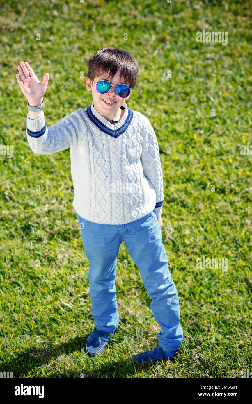 Cheerful little boy having relax outdoors Stock Photo - Alamy
