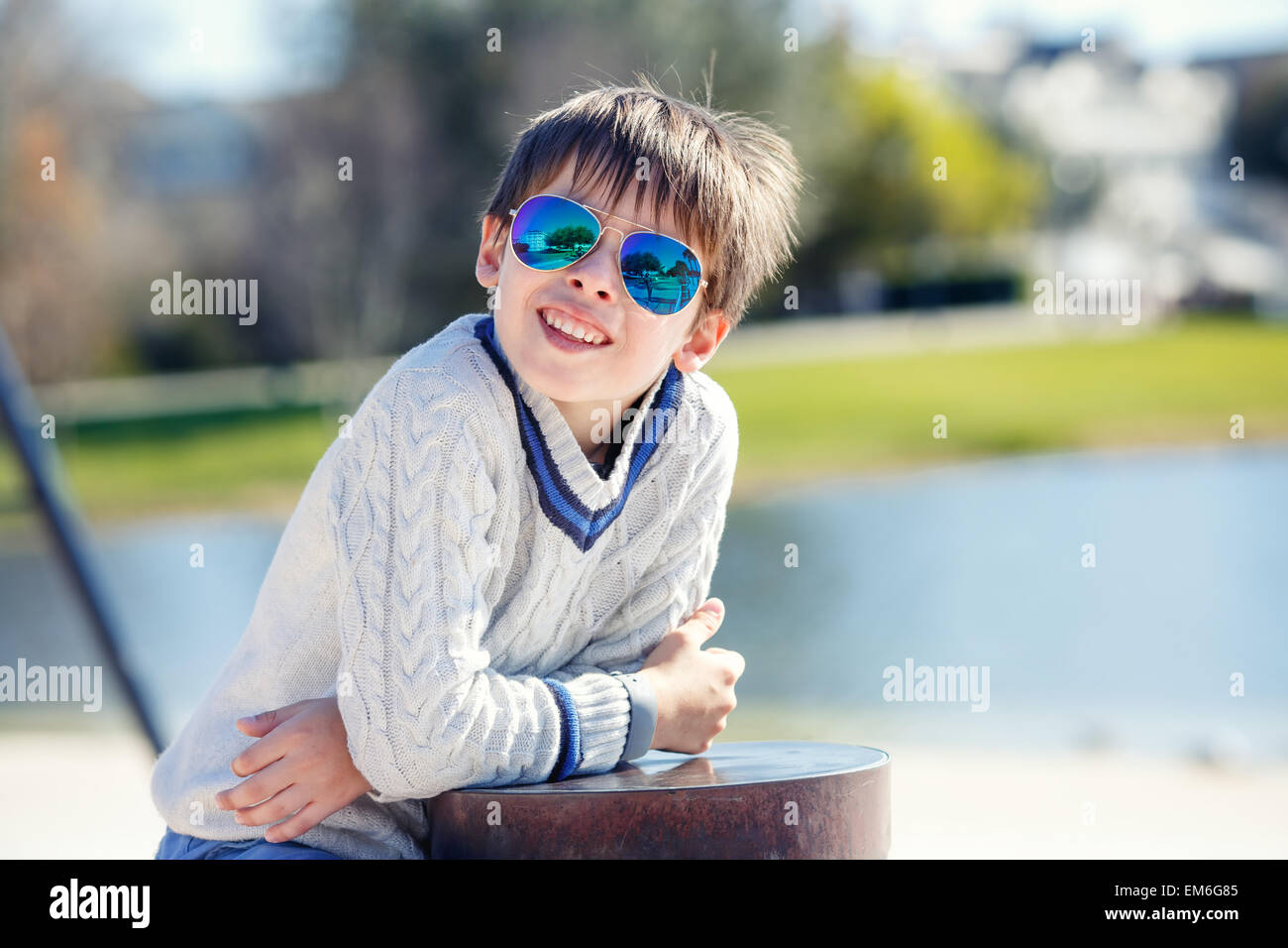 Cheerful little boy having relax outdoors Stock Photo - Alamy