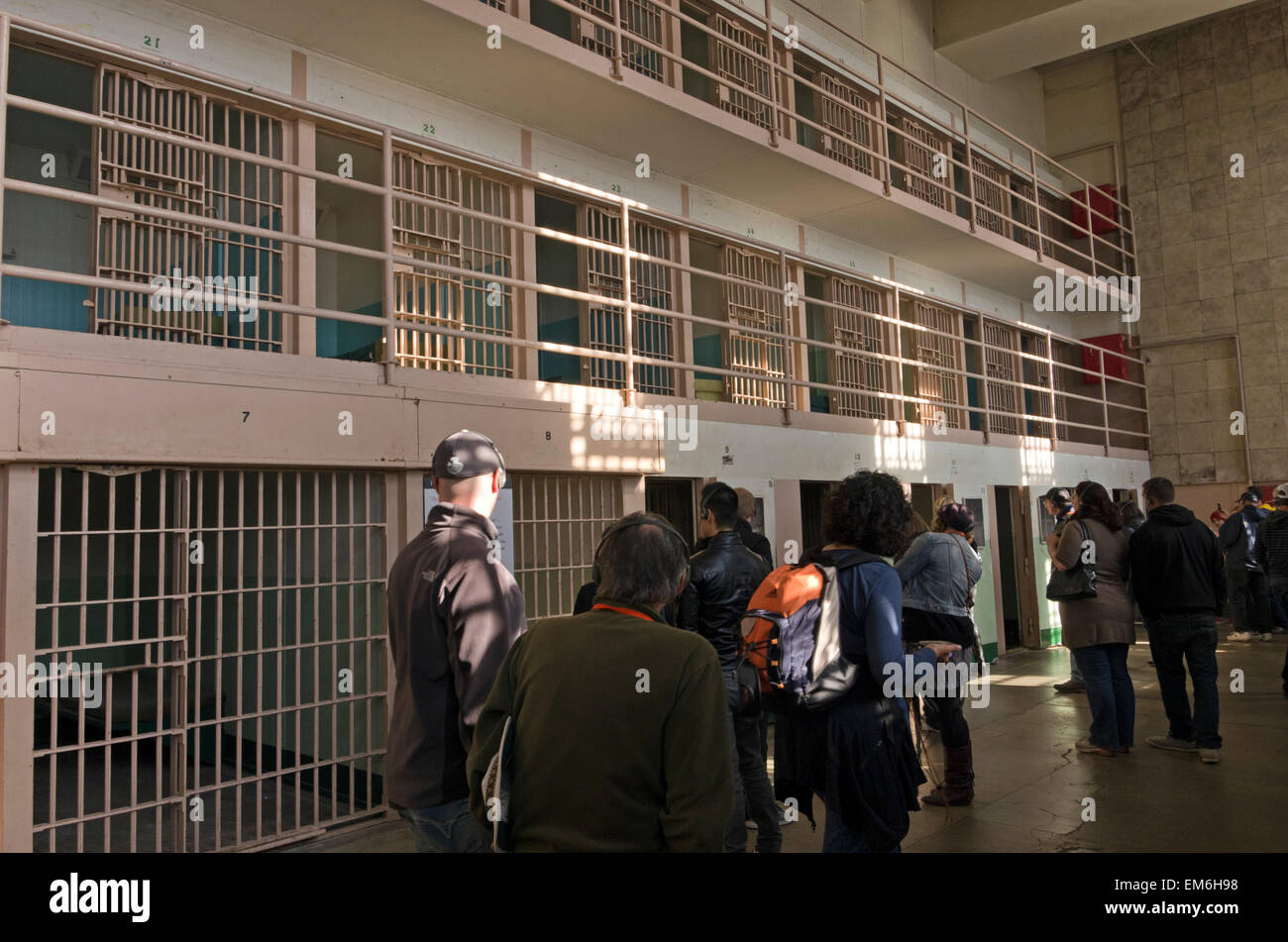 Alcatraz, tourist walk through the cell area, listening to tour ...
