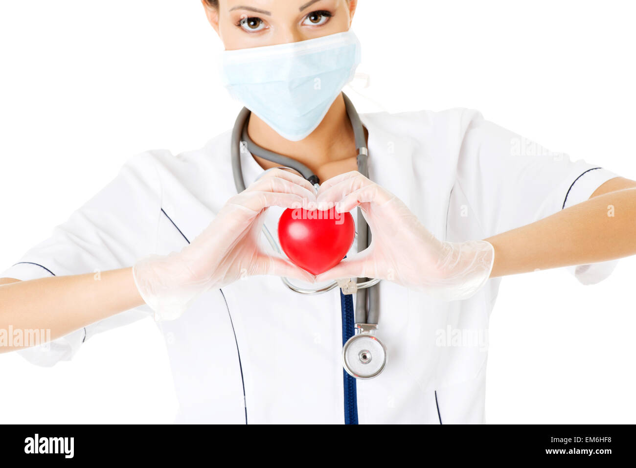 Young nurse with heart in her hand Stock Photo - Alamy