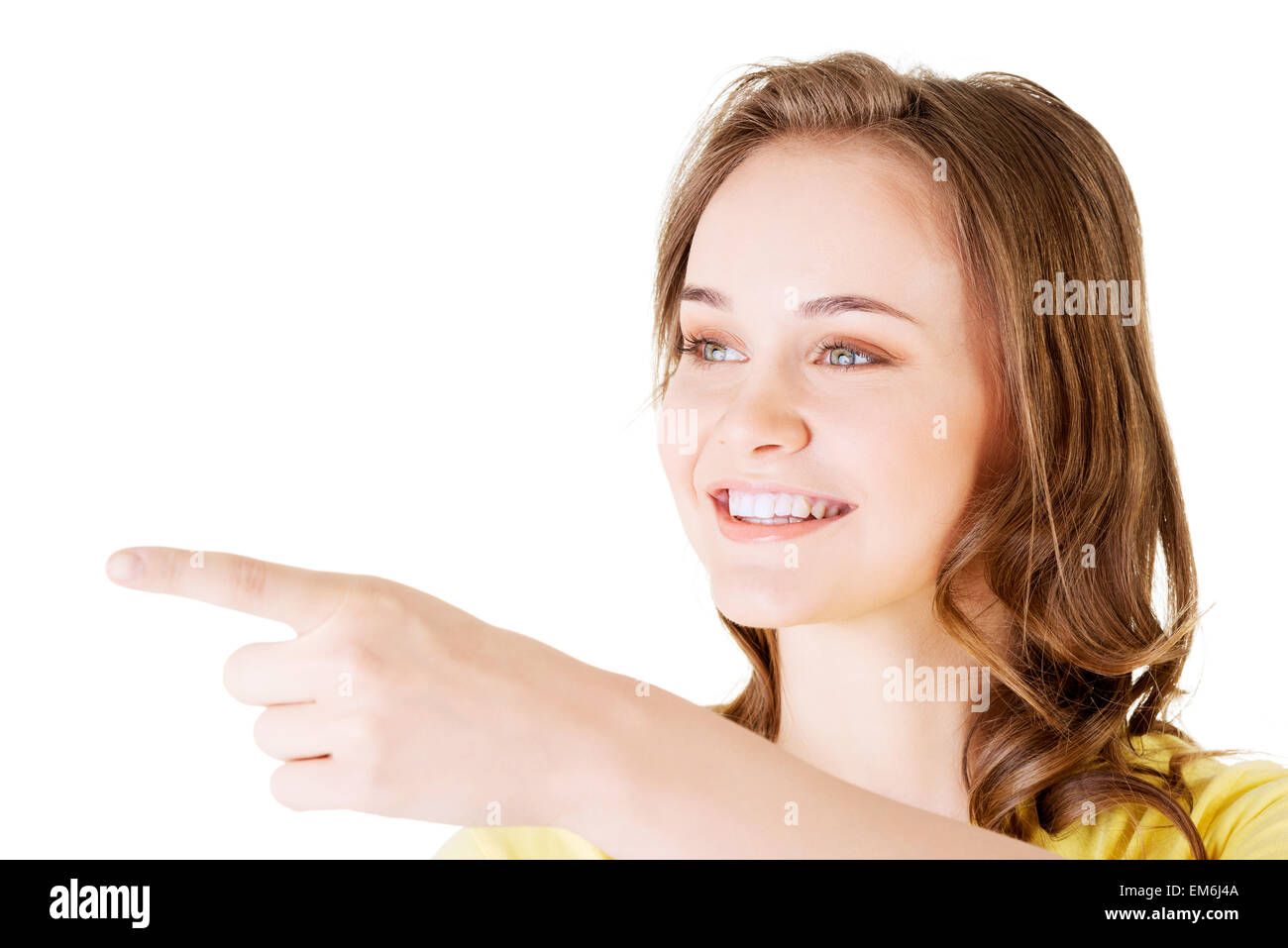 Happy , excited young woman pointing on copy space Stock Photo - Alamy