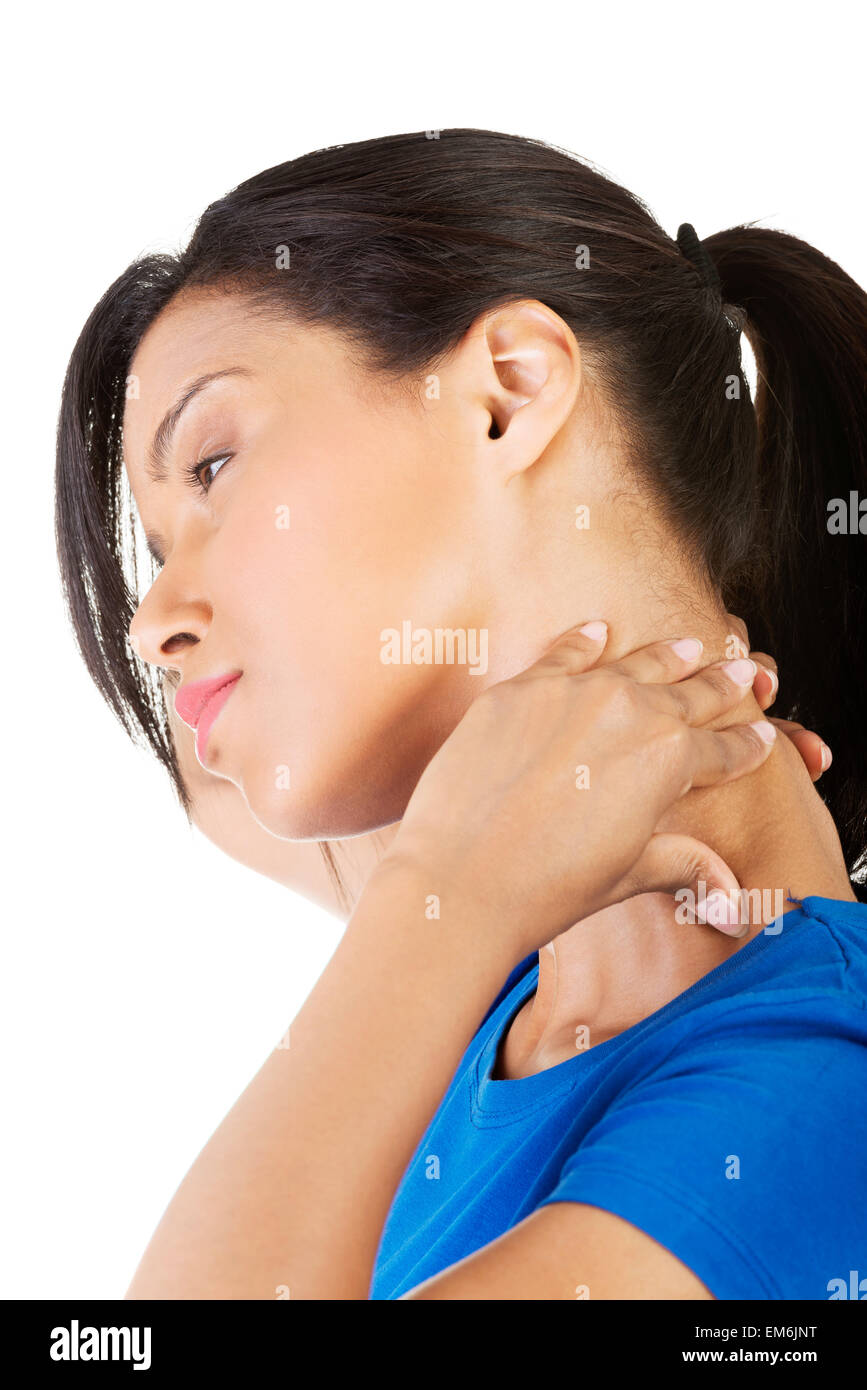 Young woman holding hand on her neck Stock Photo - Alamy