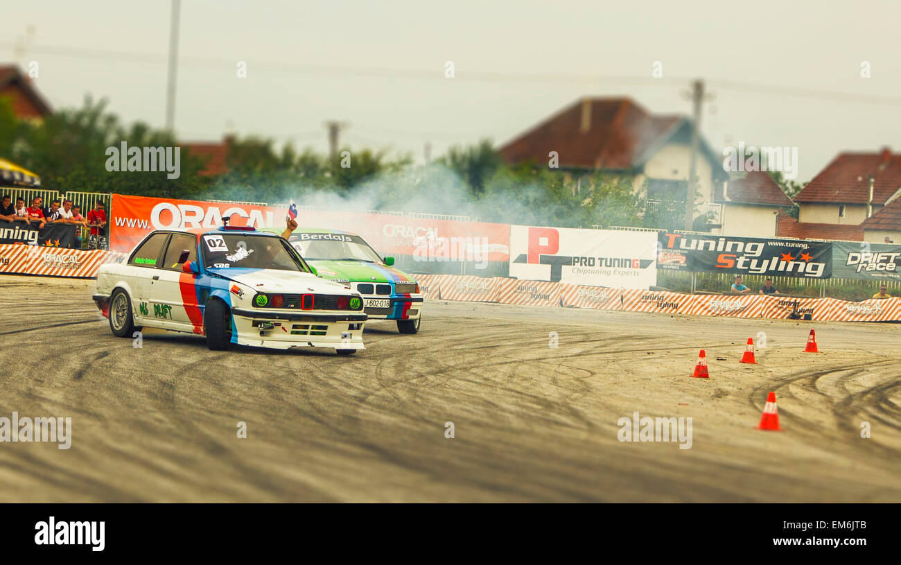 Two cars sliding in a corner Stock Photo - Alamy