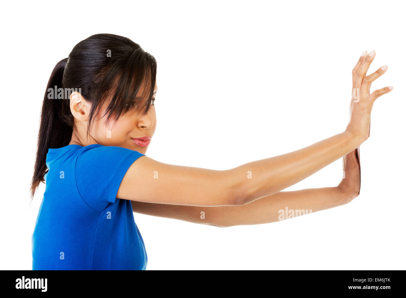 Woman pushing something imaginary Stock Photo - Alamy