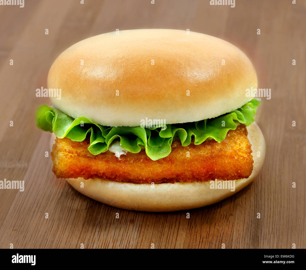 Bright photo of macro tasty burger with fish fillet on a dark wooden ...