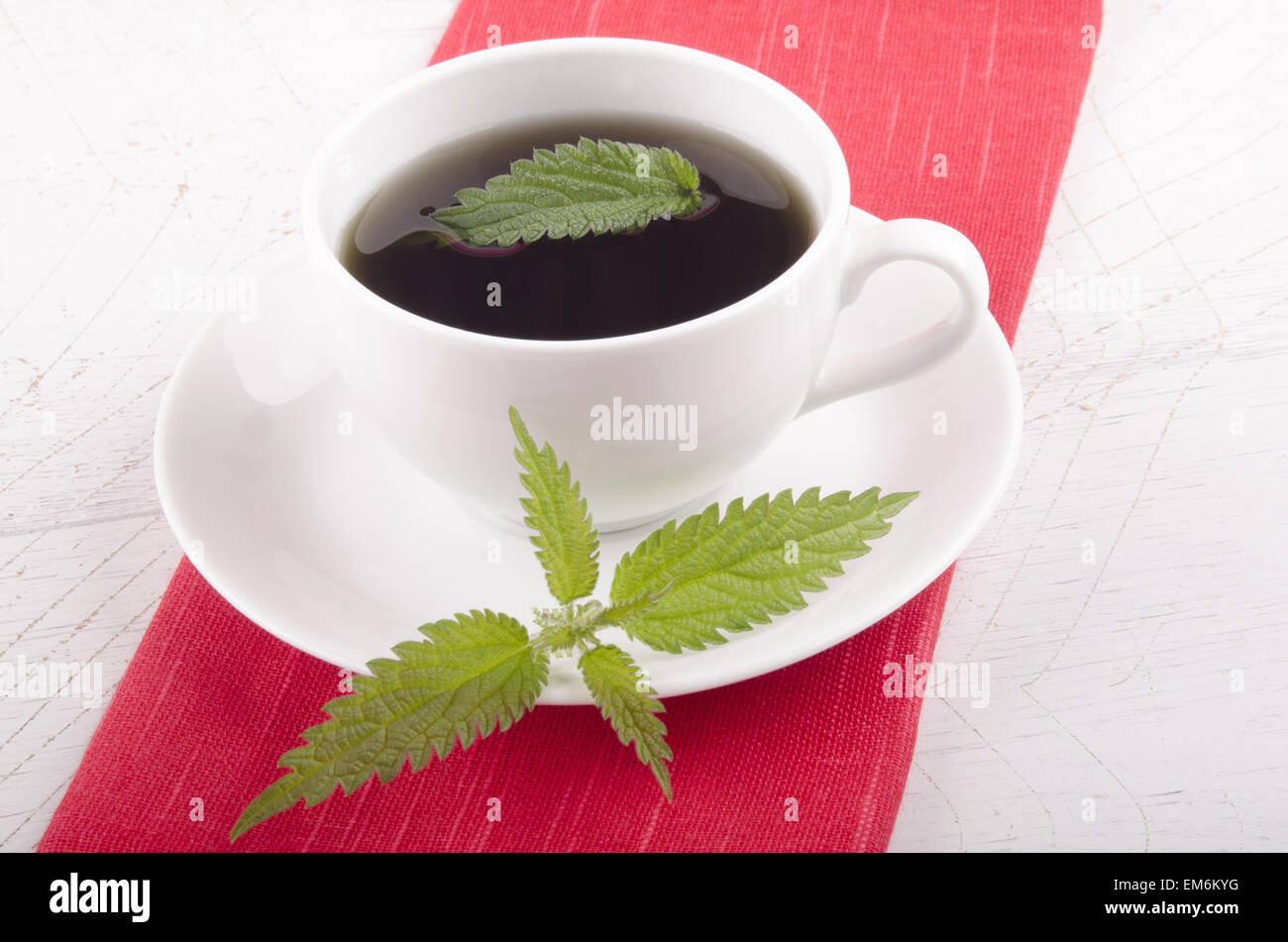 nettle tea in a white cup Stock Photo - Alamy