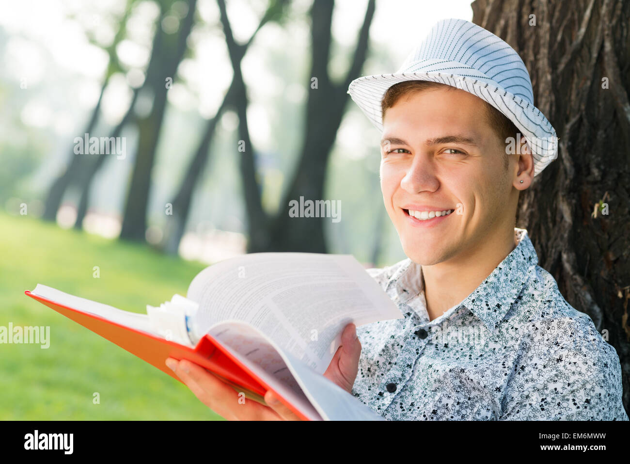 young man reading a book Stock Photo - Alamy