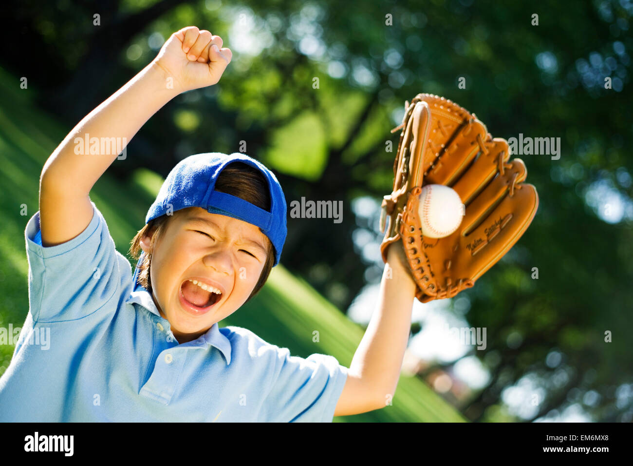 Young Japanese Child Playing With Baseball Stock Photo - Alamy