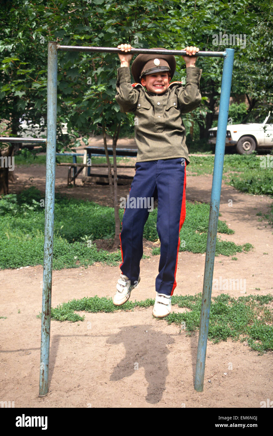 A young Russian Don Cossacks struggles to perform pull-ups at the Don ...