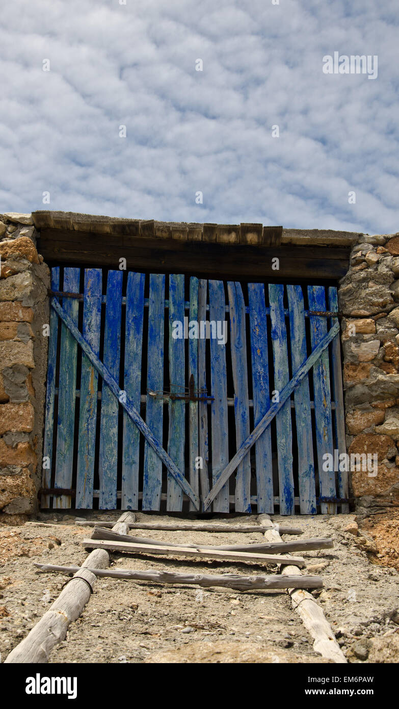 Boat hut with blue door Stock Photo - Alamy