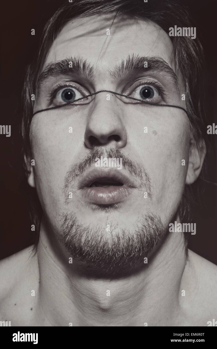 Strange portrait of a young man close up Stock Photo - Alamy