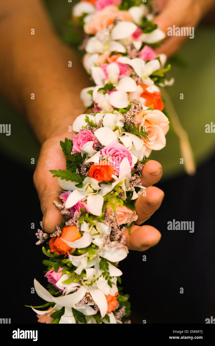Hands Holding Detail Flower Lei Stock Photo - Alamy