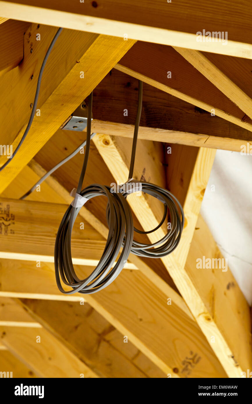 Interior of new building under construction showing electric cables ...