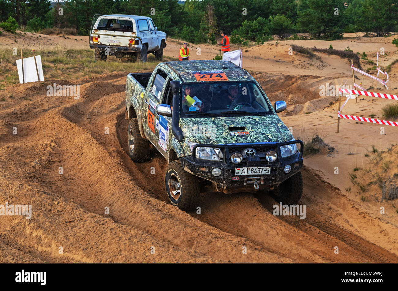Races on a rally-raid on sandy dunes. Rally-raid Baha "Belarus" 2014 ...