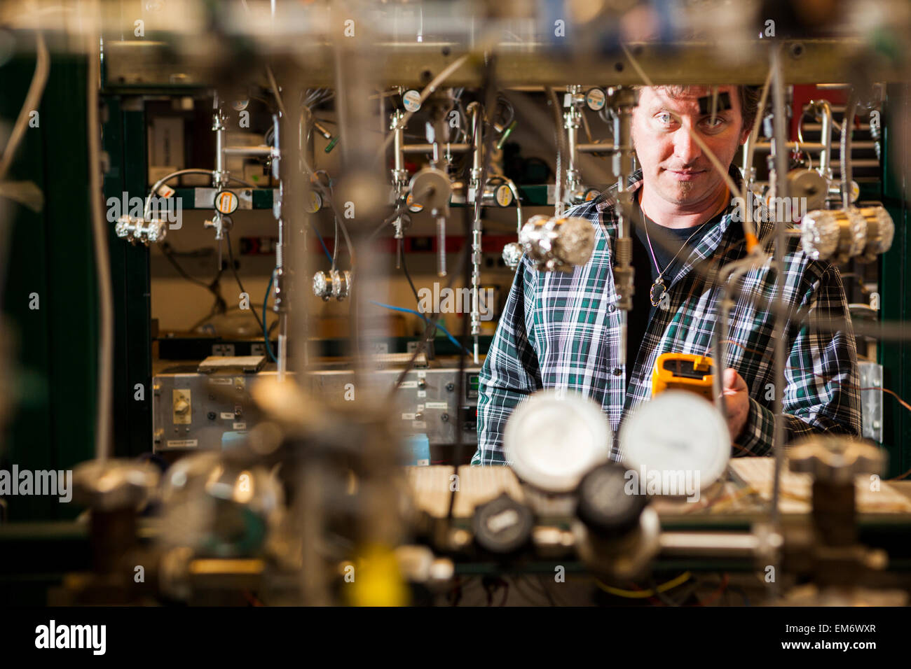 A man takes measurements at a radiocarbon laboratory in Boulder ...