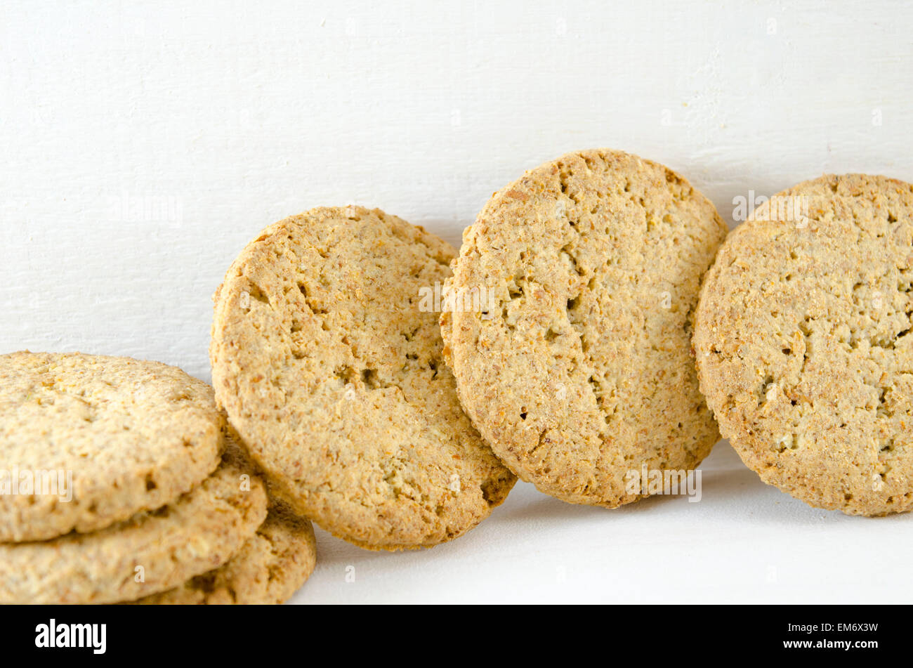 Fresh integral cookies and wheat on white background Stock Photo - Alamy
