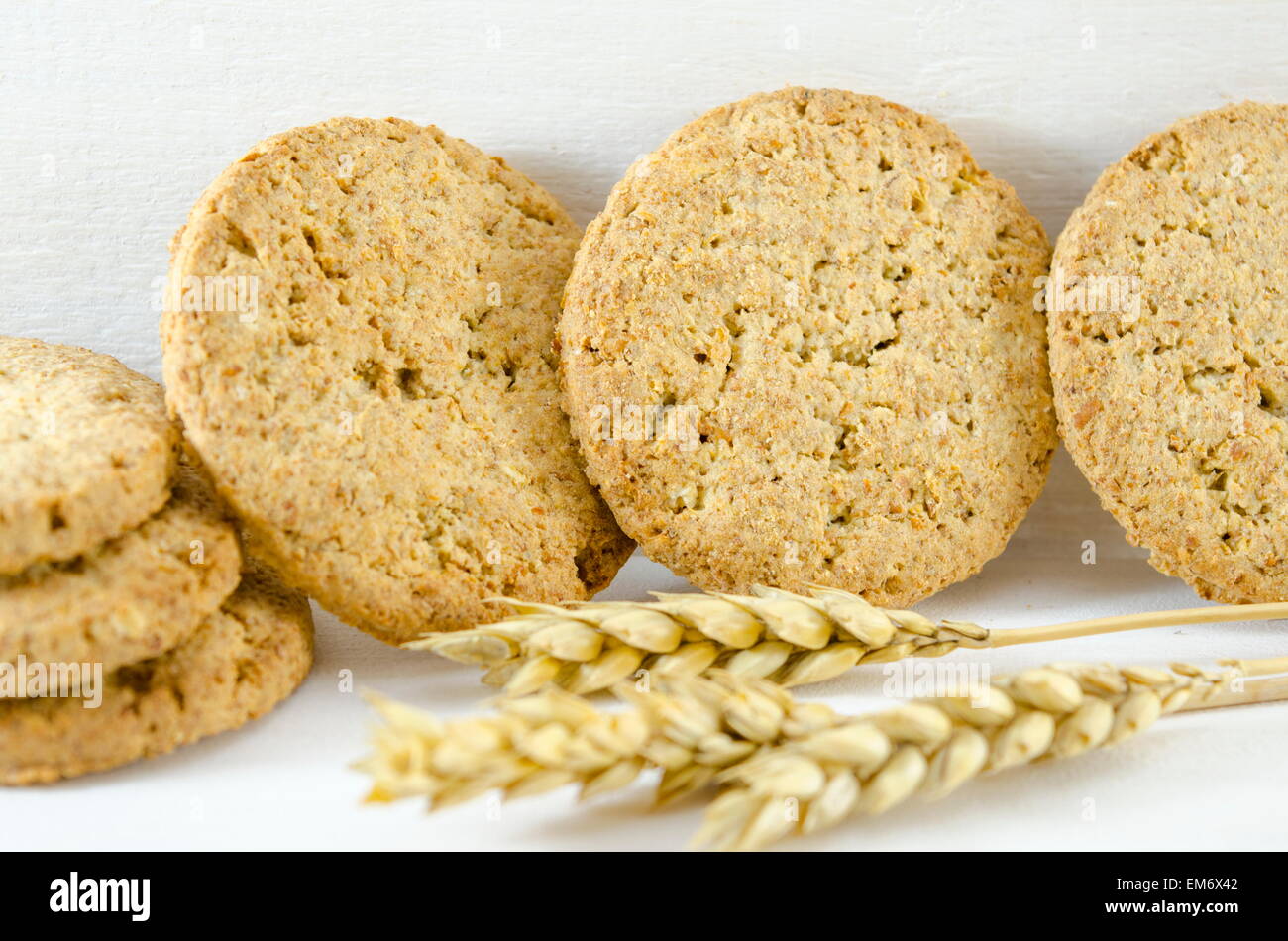 Fresh integral cookies and wheat on white background Stock Photo - Alamy