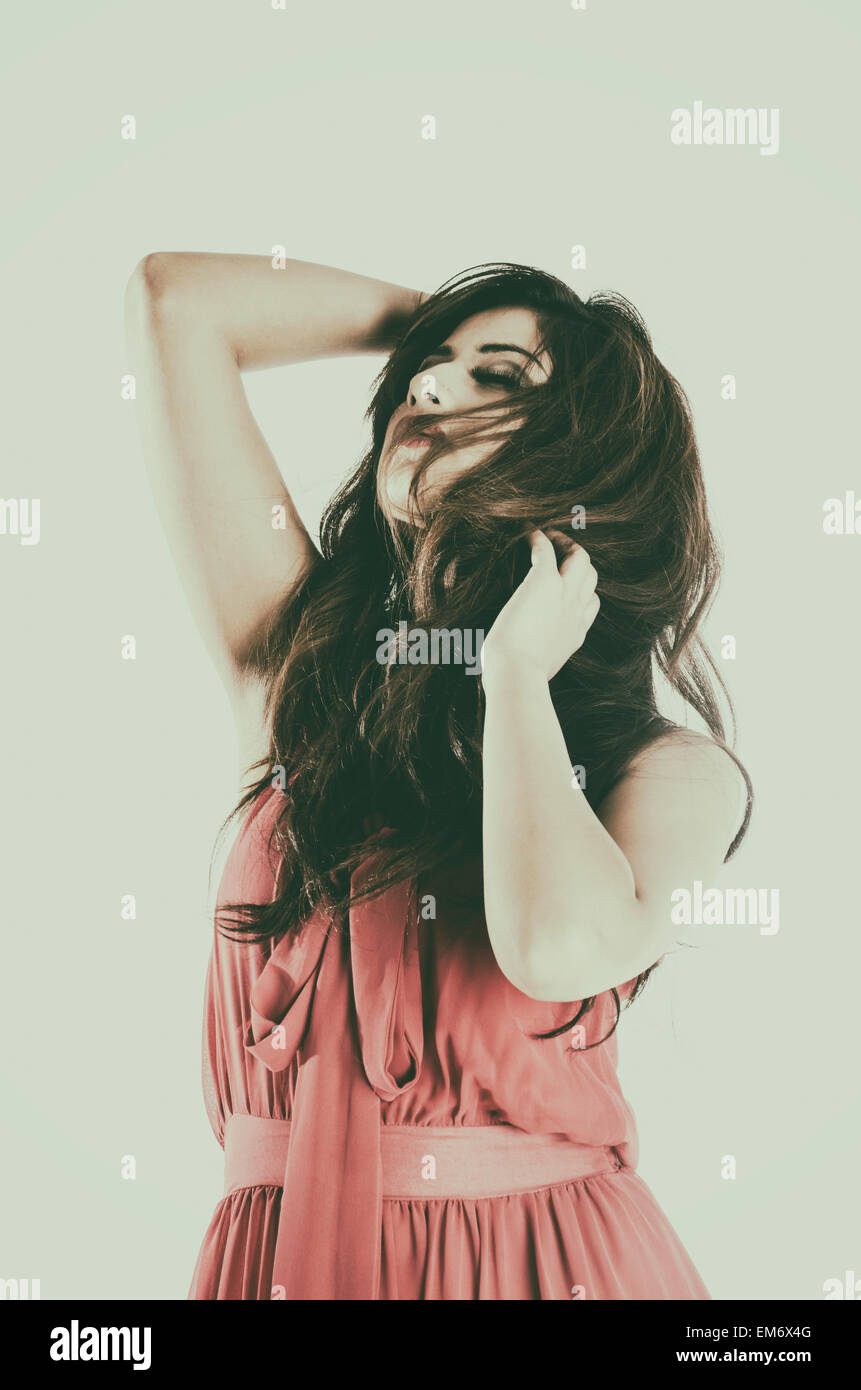 Beautiful young woman hands touching hair Stock Photo - Alamy