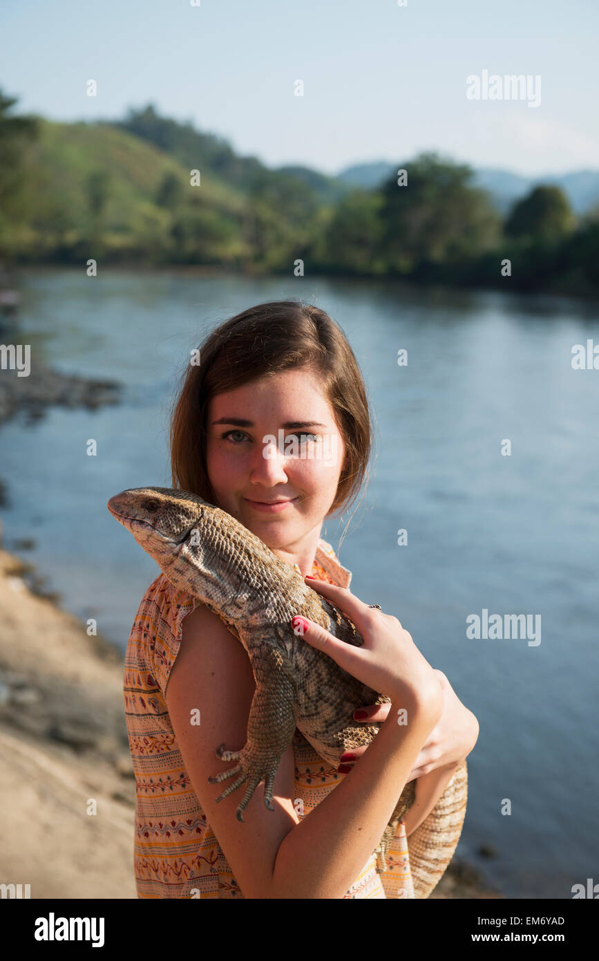 Girl holding a lizard; Thaton, Chiang Rai, Thailand Stock Photo - Alamy