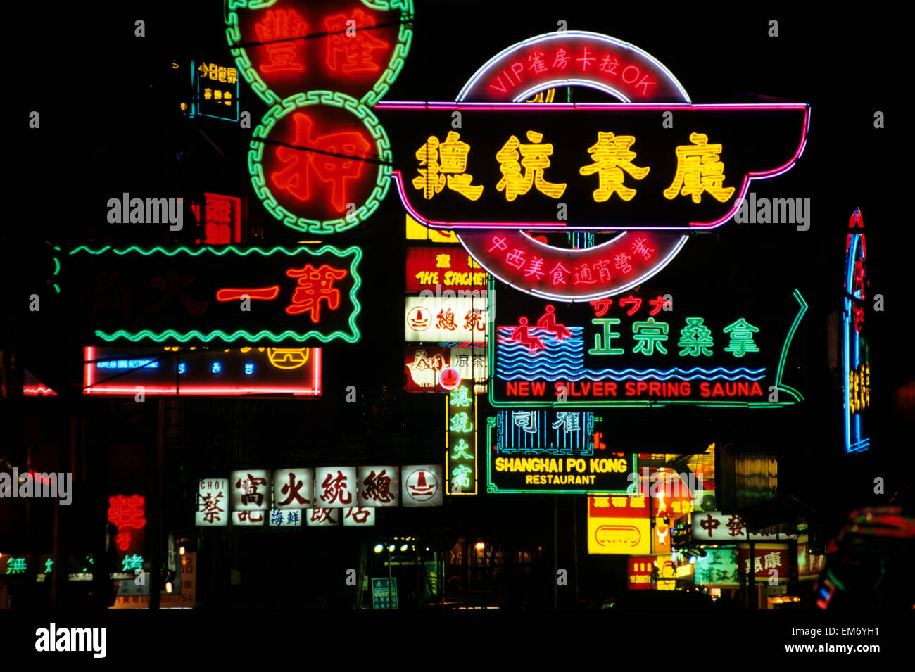 Colourful neon signs illuminated on a street at nighttime; Hong Kong ...