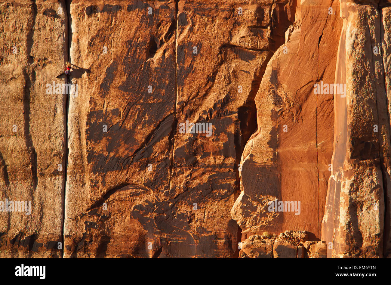 A rock climber on Generic Crack 5.10; Indian Creek, Utah, United States ...