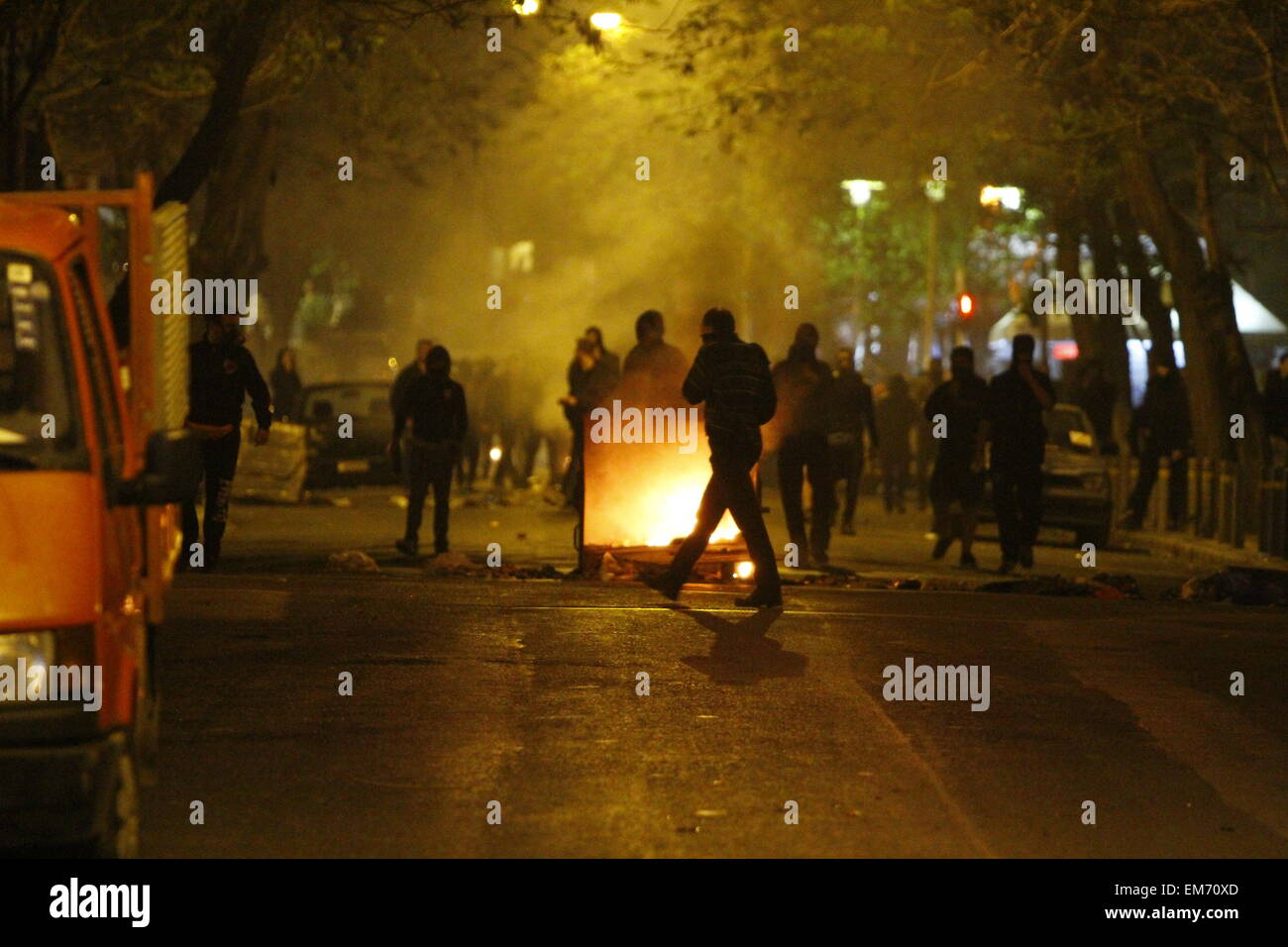 Athens, Greece. 16th April 2015. Protesters stand around a burning ...