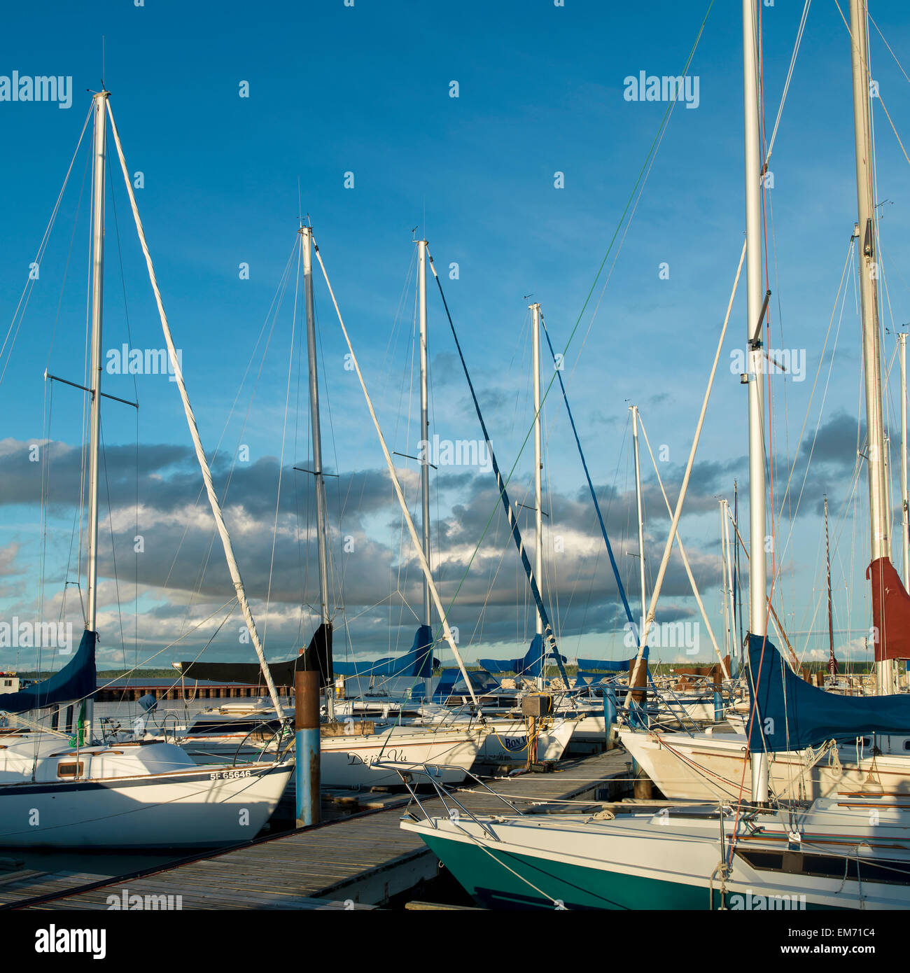 Sailboats mooring along a dock in Hecla-Grindstone Provincial Park ...