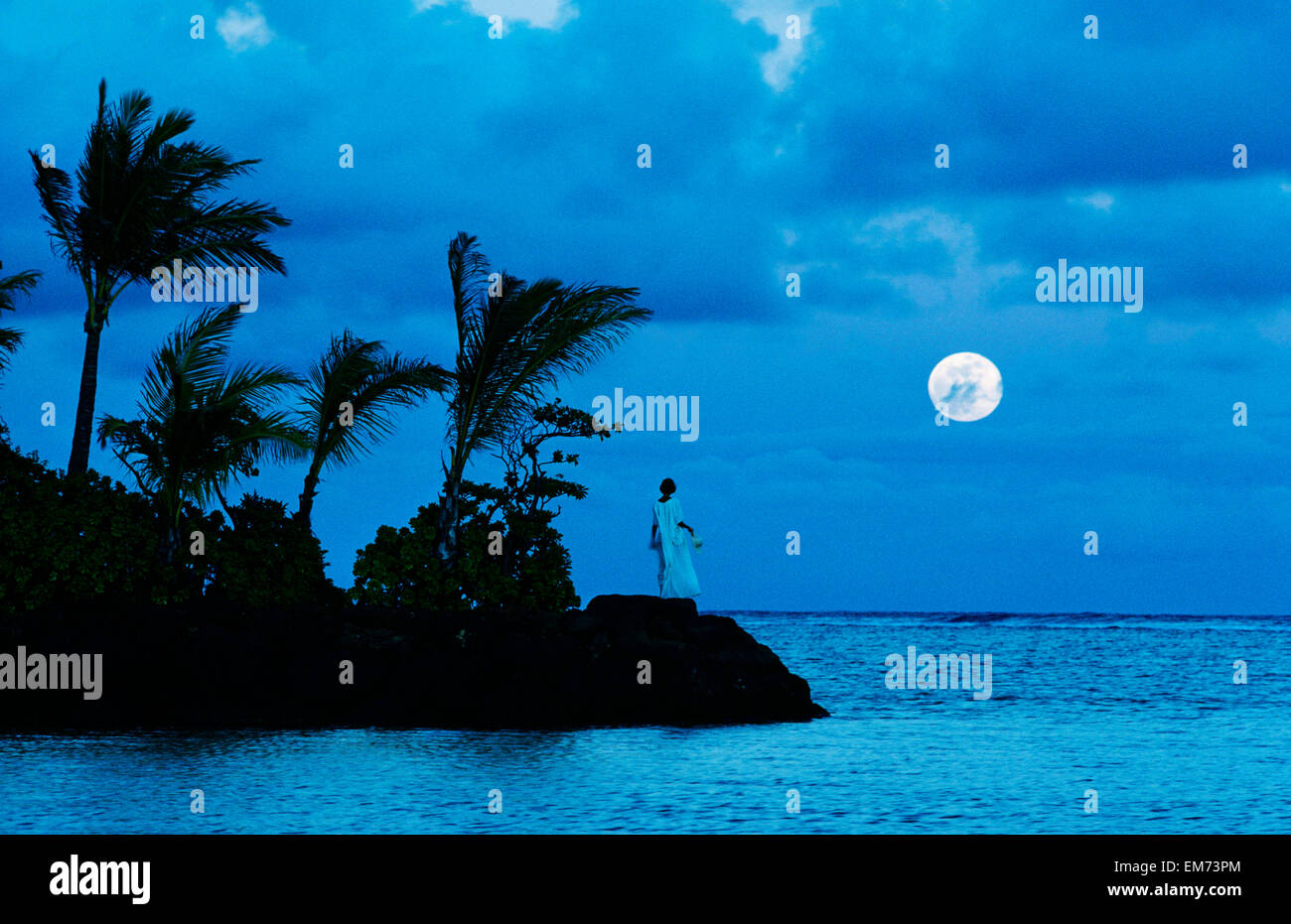 Hawaii, Oahu, Kahala Coastline, Woman Standing On Rocks Watching Moon ...