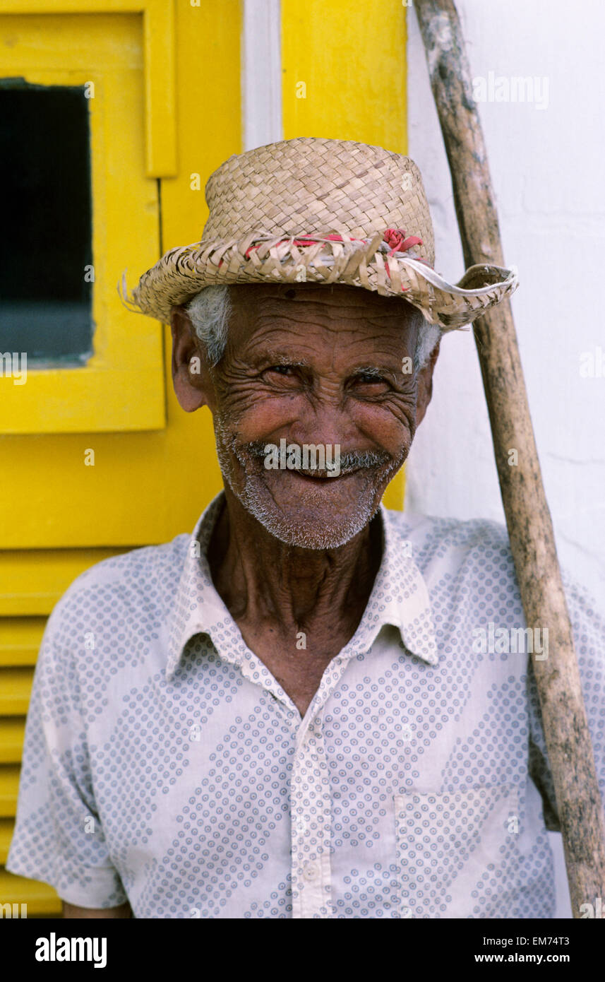 Brazil, Buzios, Portrait Of Local Man Standing Next To Yellow Door With ...