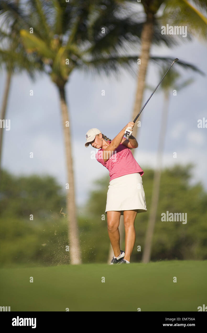 Hawaii, Maui, Wailea Gold Golf Course, Female Golfer Swinging Golf Club ...