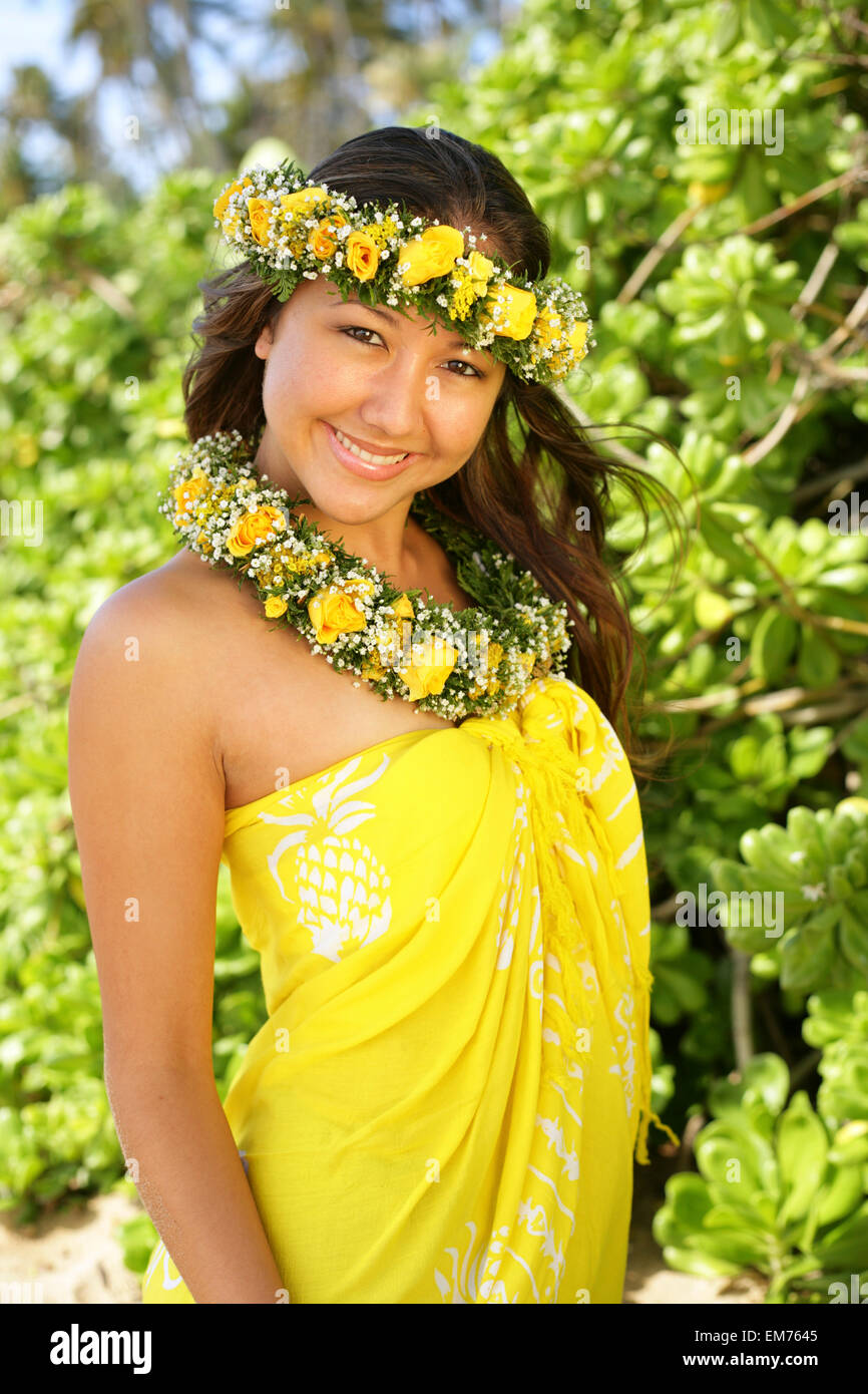 Hawaii, Local Girl Wearing Bright Yellow Pareo And Flower Leis Stock ...