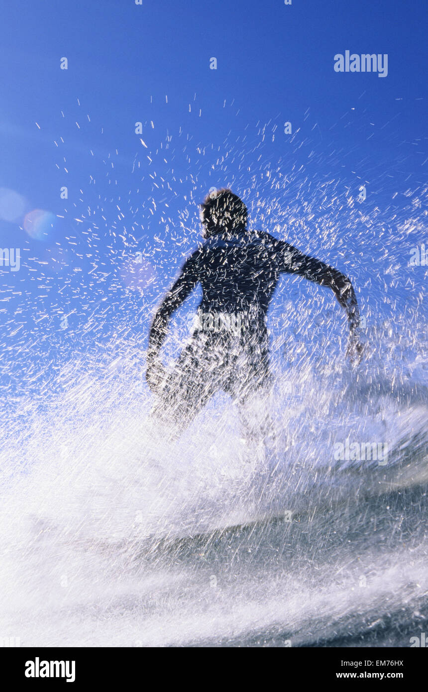Hawaii, Silhouette Of Man Riding Wave On Longboard Amid Ocean Spray. No ...
