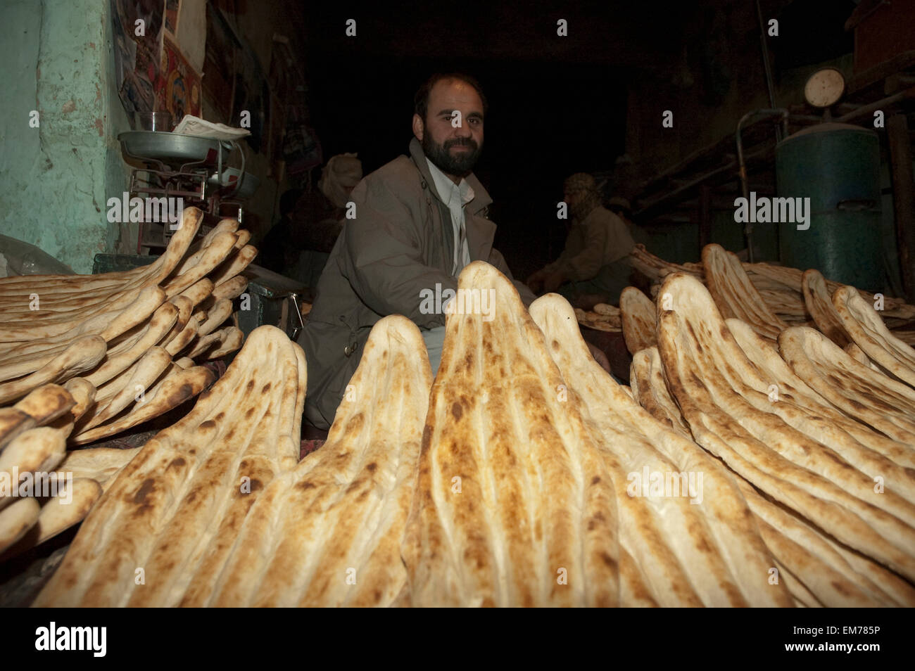Afghan Man And Freshly Baked Nan (Unleavened Bread) In A Kabul Bakery ...