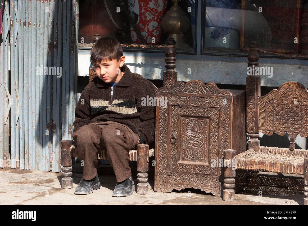 Afghan Boy Sitting On An Antique Chair In Chicken Street In Kabul ...